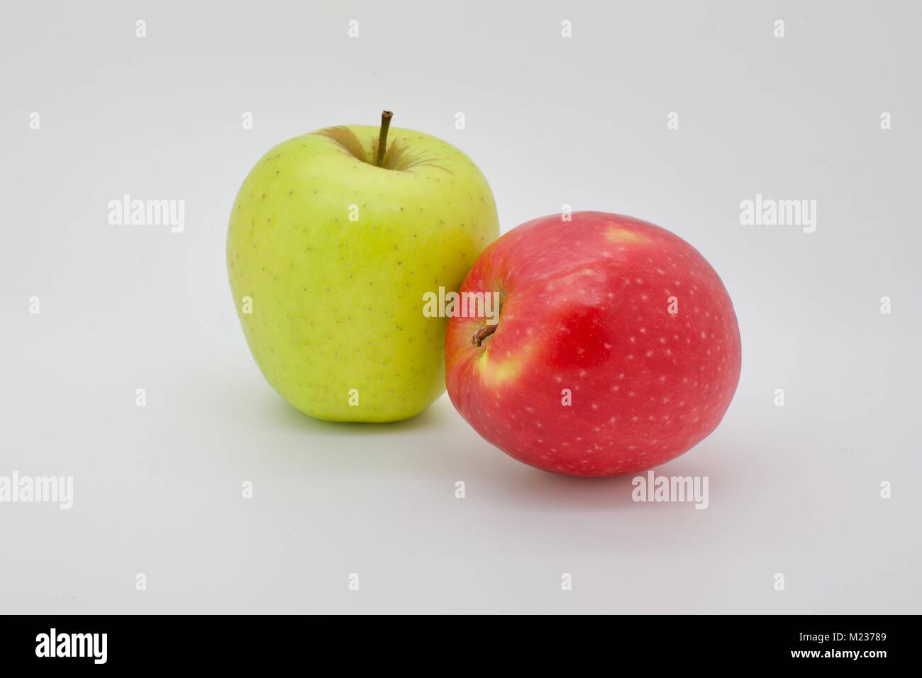 Two varieties of apples one Golden Delicious and a rosy red Jazz apple ...
