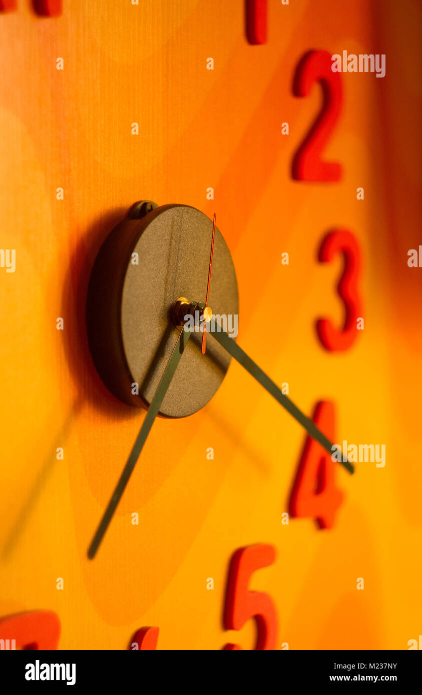 large wall clock with colorful numbers, close up Stock Photo - Alamy