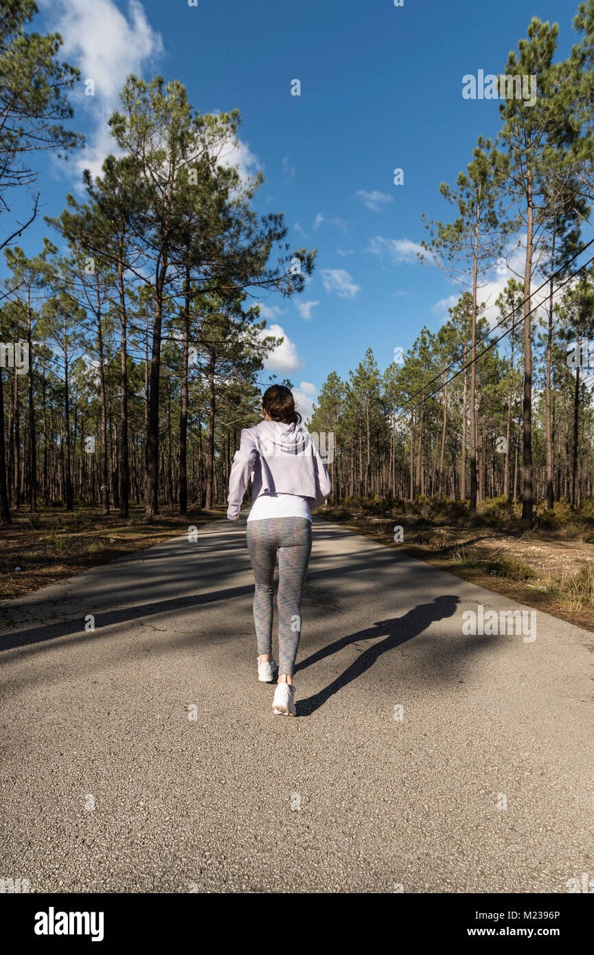 Back view woman jogging on hi-res stock photography and images - Alamy