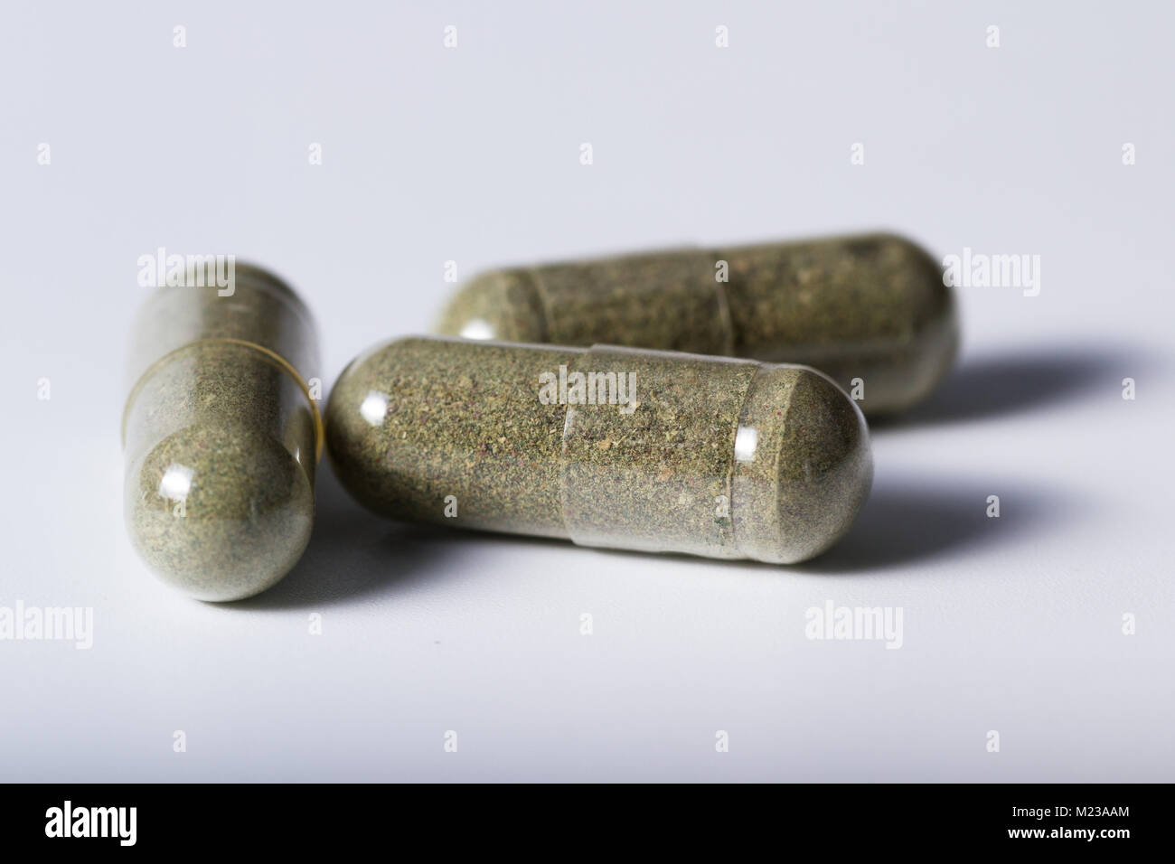 close up of a group of capsule health supplements over a white ...