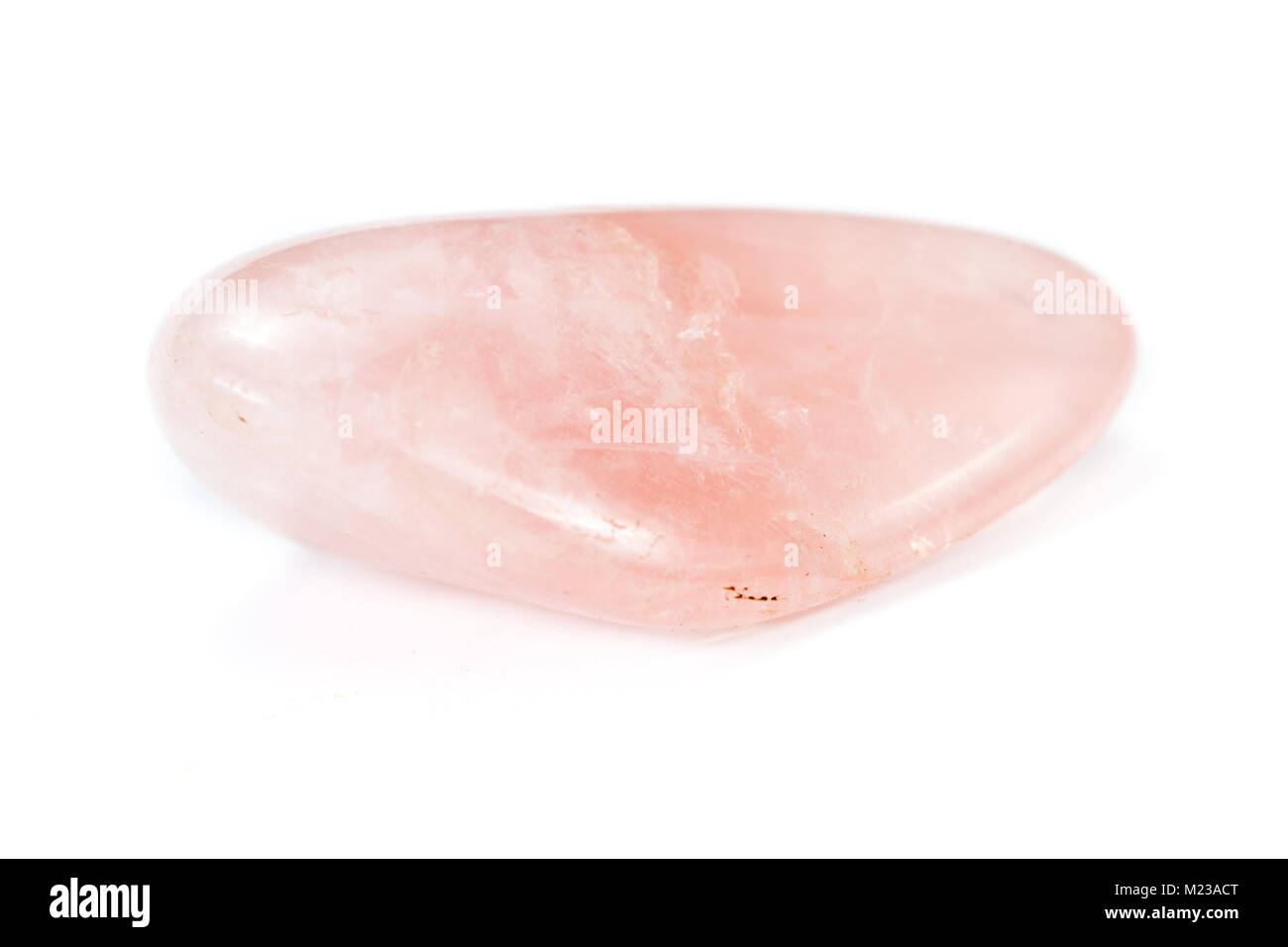 polished piece of rose quartz isolated on a white background Stock ...
