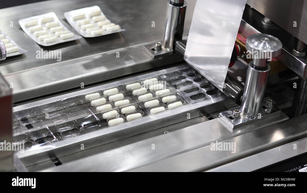 medical capsules packing process by machine ; close up Stock Photo - Alamy