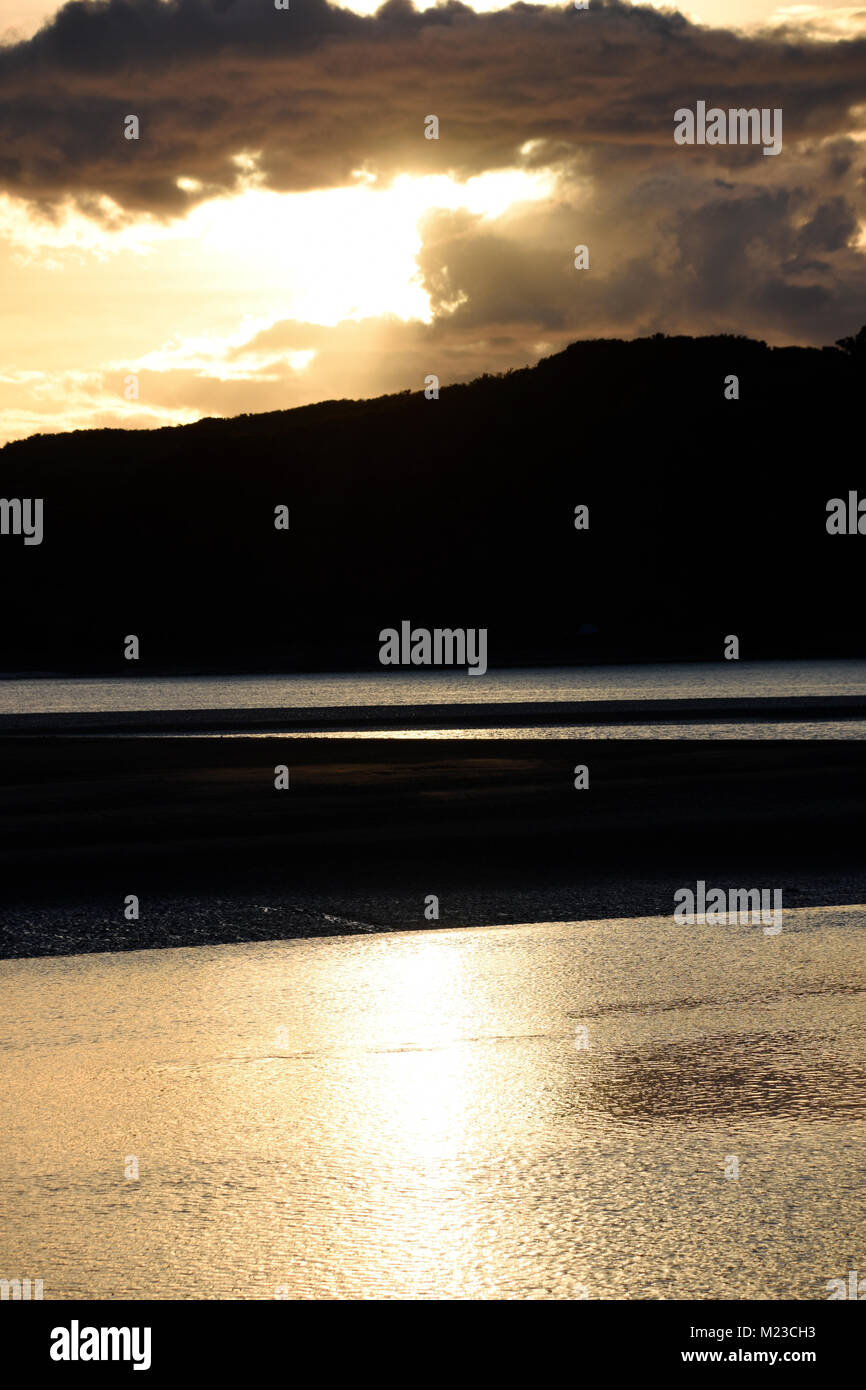 Sunset over the Raglan waters Stock Photo - Alamy
