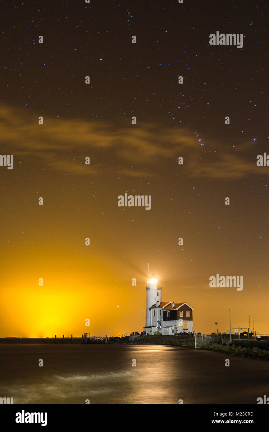 The Lighthouse 'Horse of Marken' with its lantern illuminating a Dutch ...