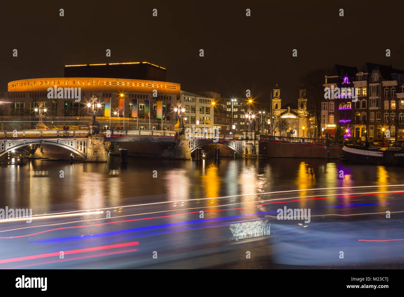 Night scene in the Amsterdam city center with Stopera housing the city ...