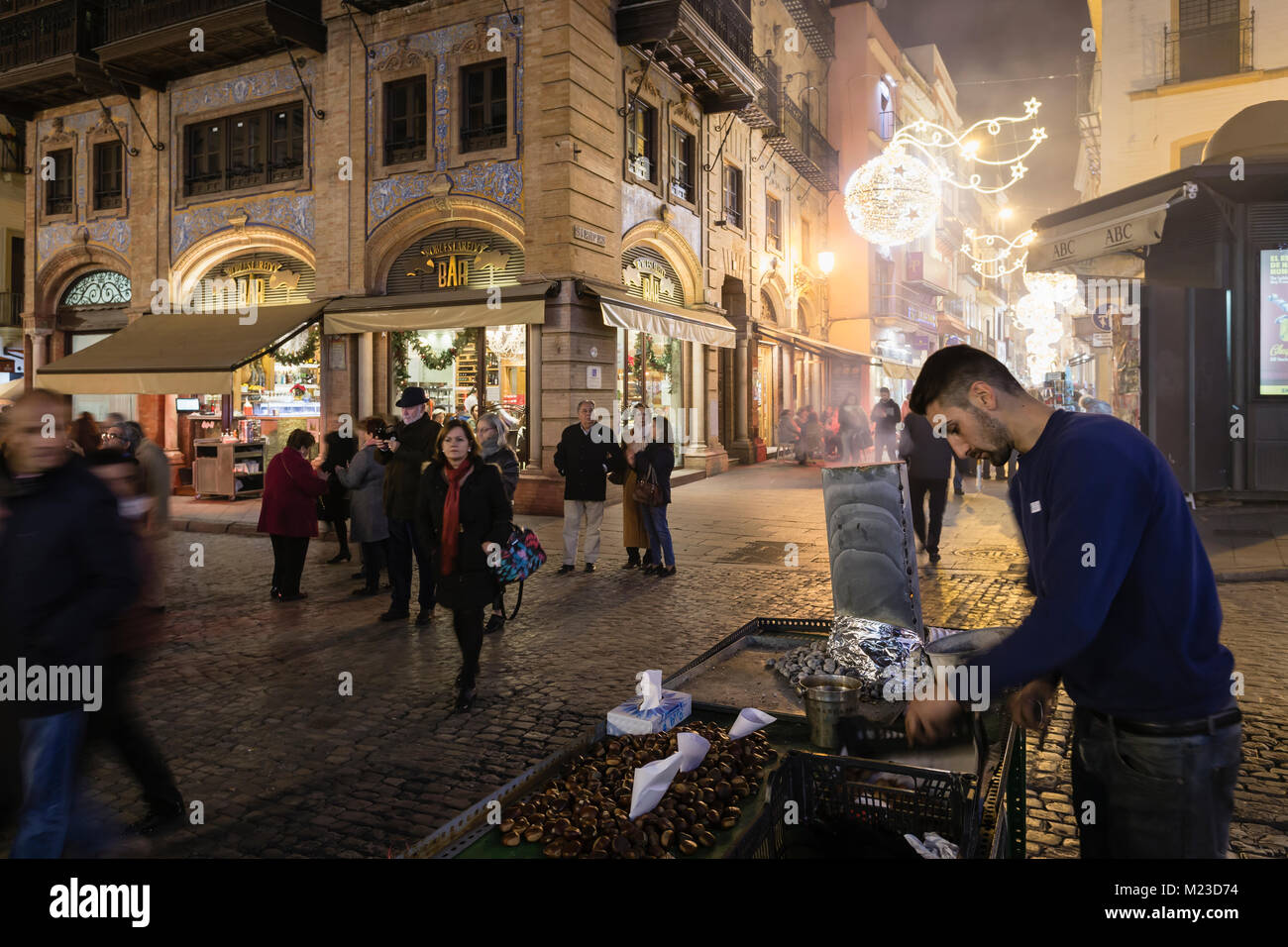 Roasted chestnut stall in Seville, Andalusia, Spain Stock Photo - Alamy