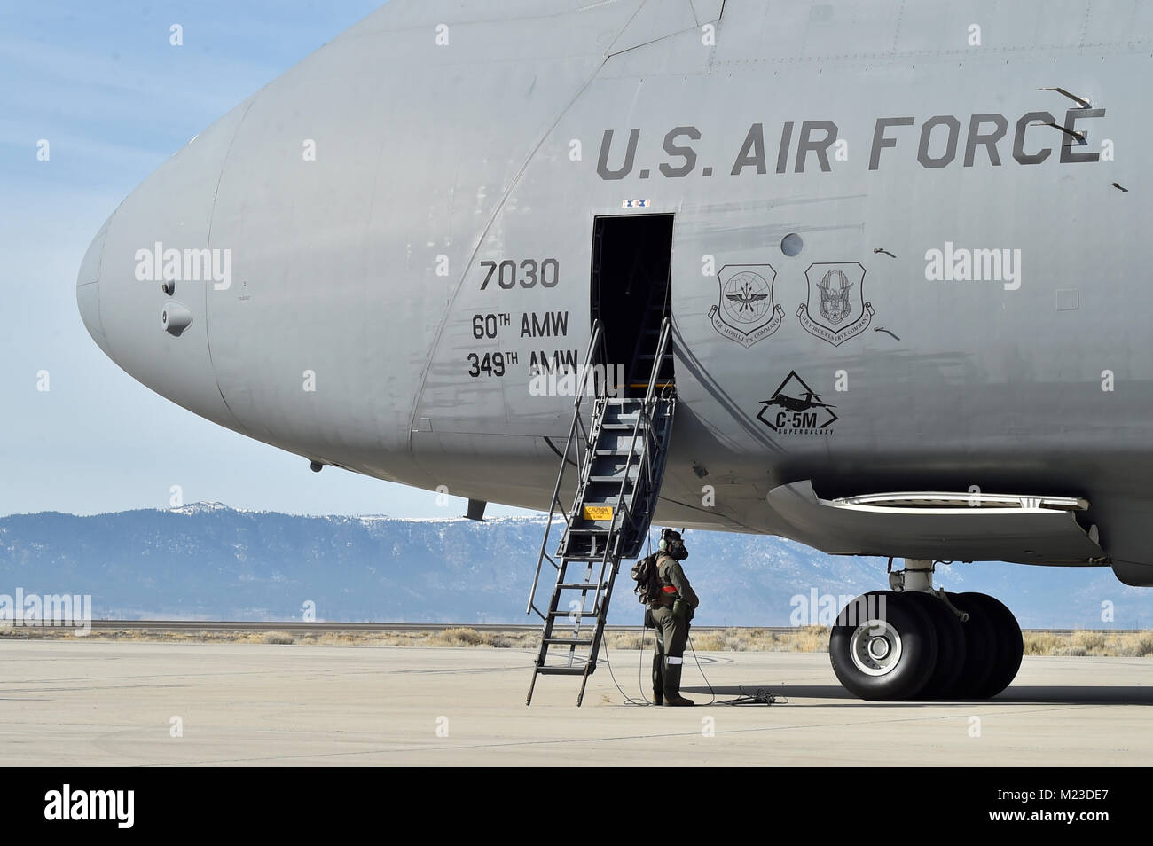 A crew chief performs a pre-flight check on a C5-M Super Galaxy at ...