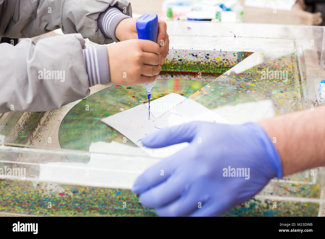 educational games, handcraft, painting concept. close up of two couples ...