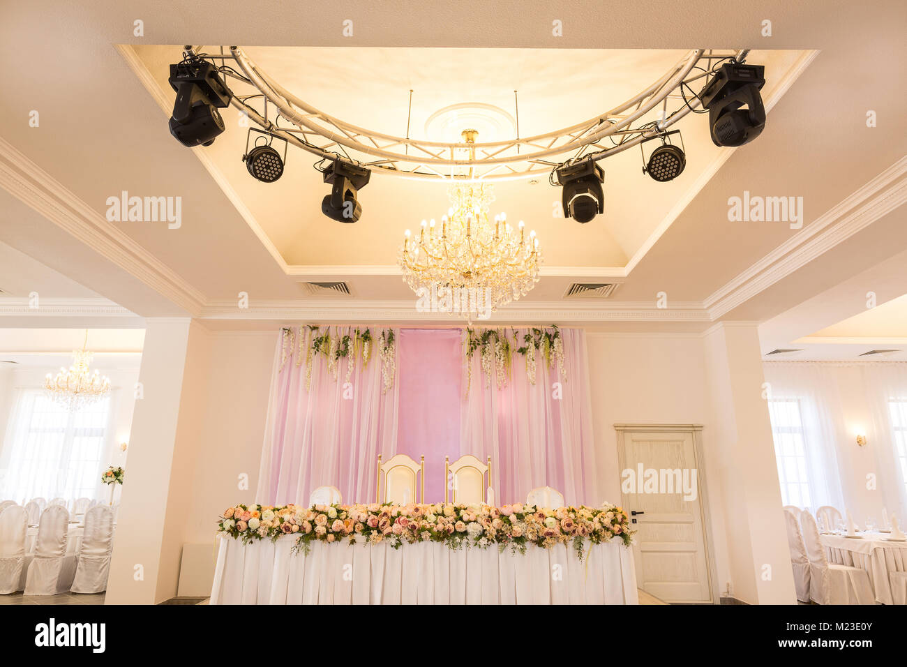 wedding, design, party concept. in the center of the hall there is a ...