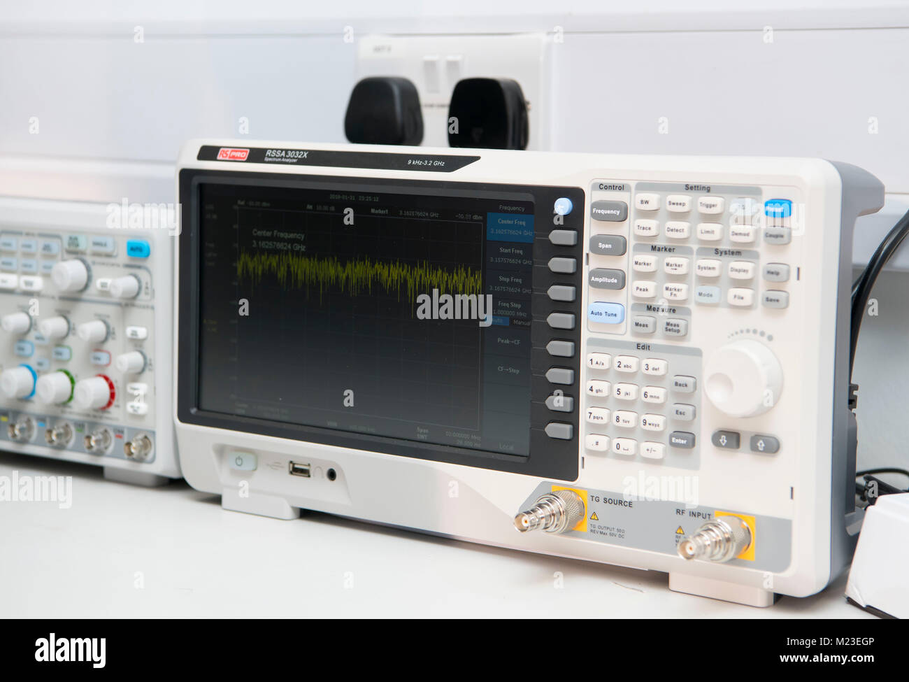 A spectrum analyser / oscilloscope in use in a laboratory workshop ...