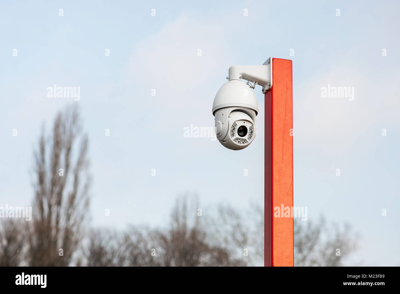 Modern white security camera for surveillance and monitoring located ...