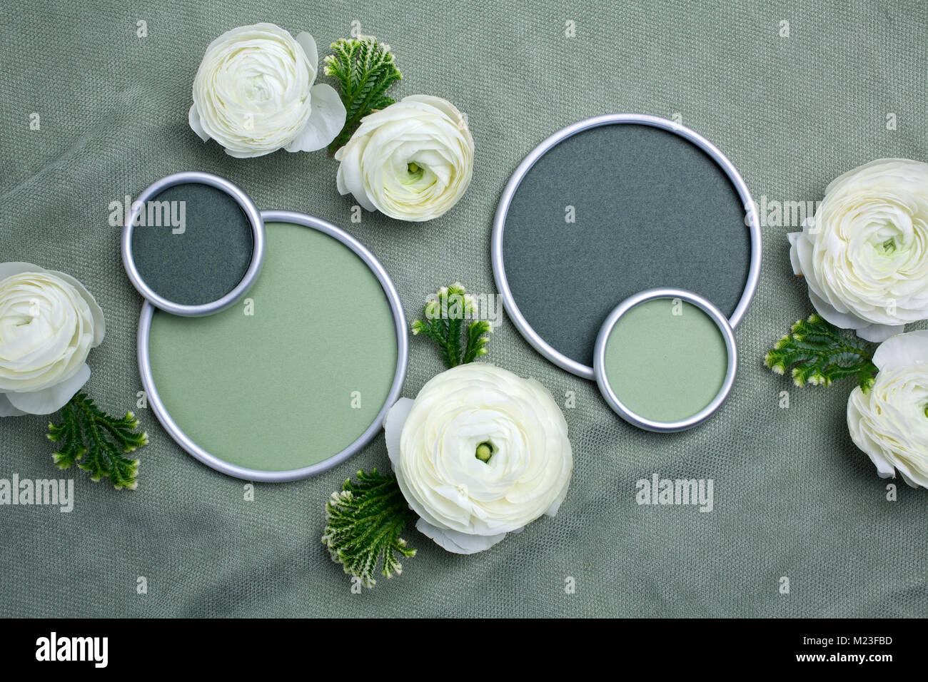 Ranunculus flowers with a round frame with a place for designer's text ...