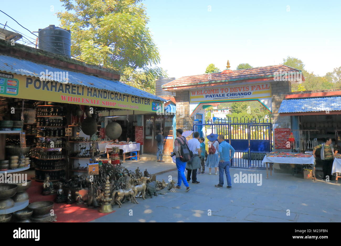 People visit souvenir shop at Devi’s Fall waterfall in Pokhara Nepal ...