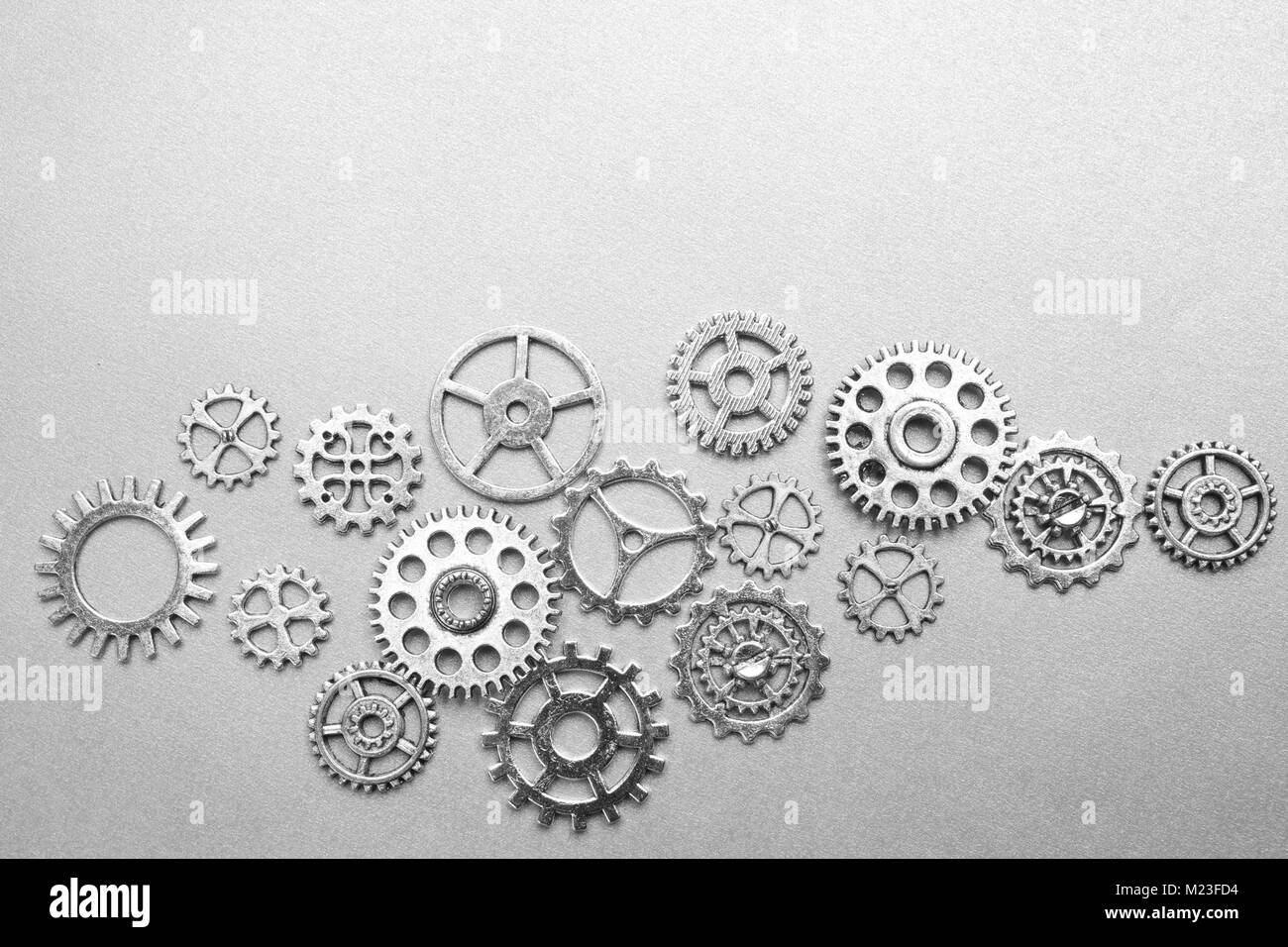 concept hour metal gears on gray background top view Stock Photo - Alamy