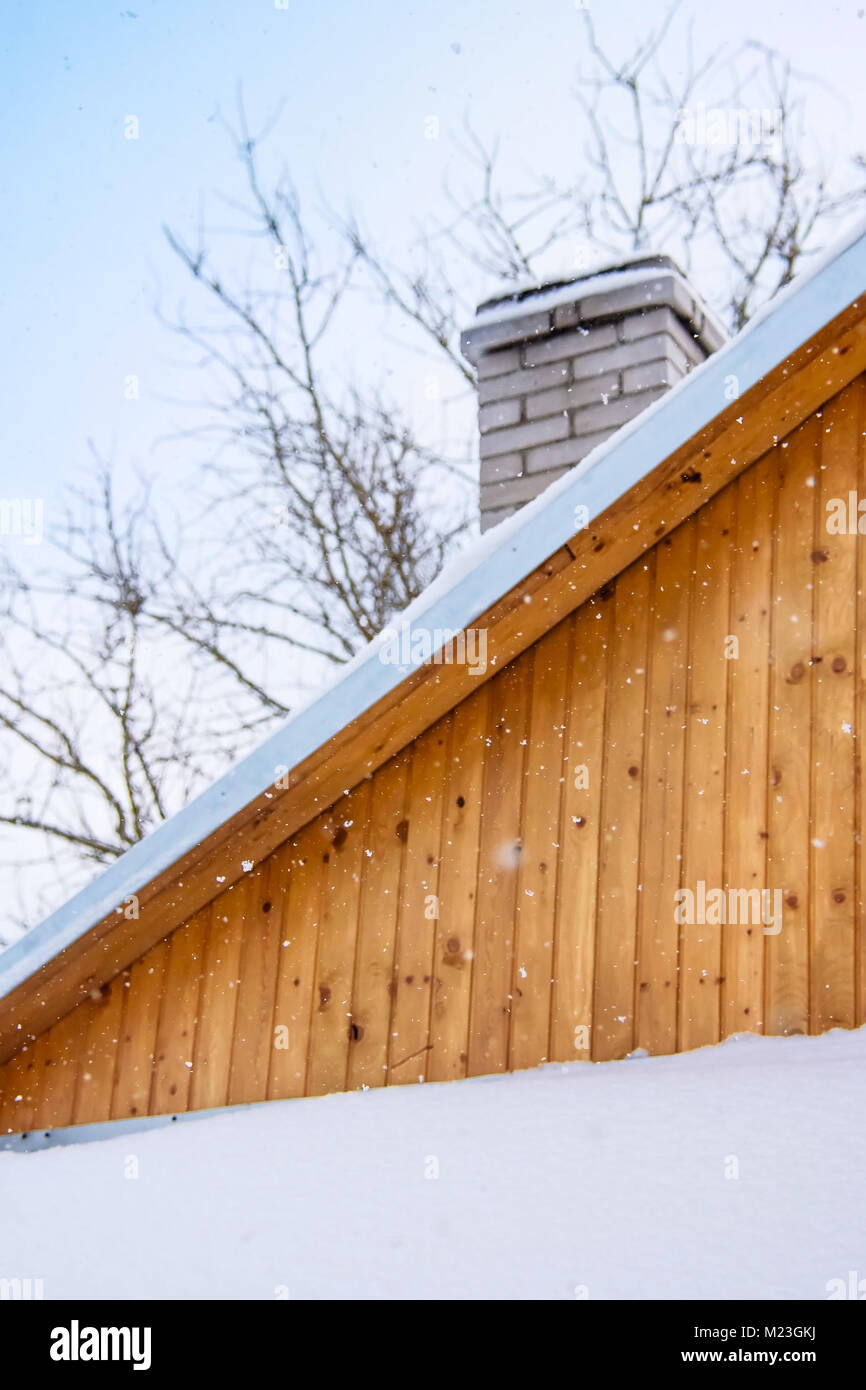 Large snowfall against the background of the rural house Stock Photo ...