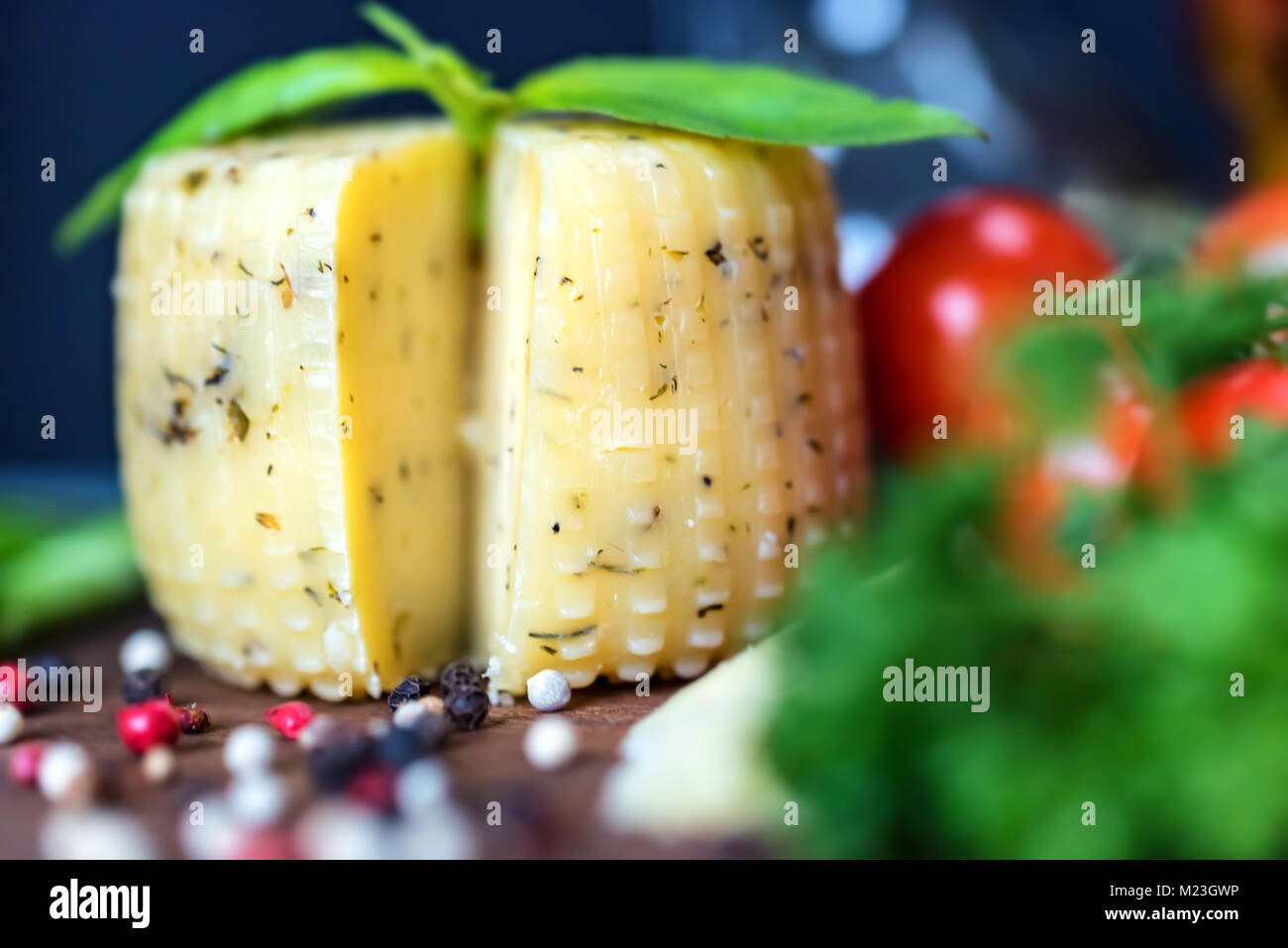 Rustic cheese with herbs, pepper and vegetables Stock Photo - Alamy