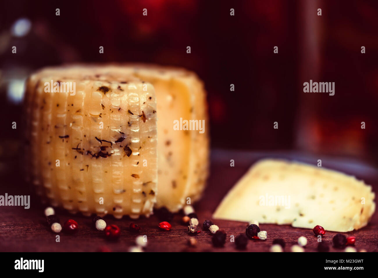 Rustic cheese with herbs and peppercorn Stock Photo - Alamy