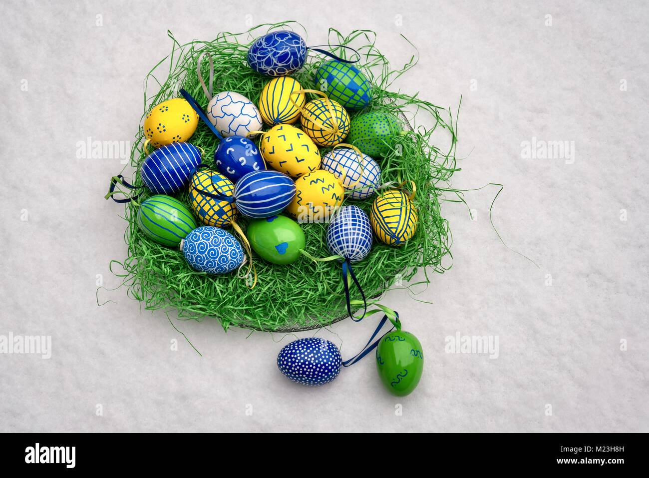 Easter eggs in the snow Stock Photo - Alamy