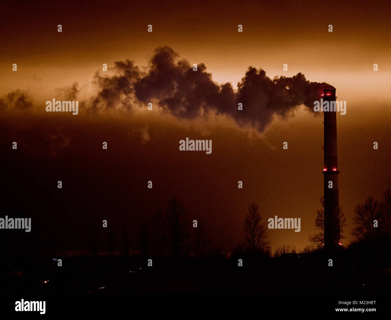 A smoking industrial pipe against the background of the night sk Stock ...