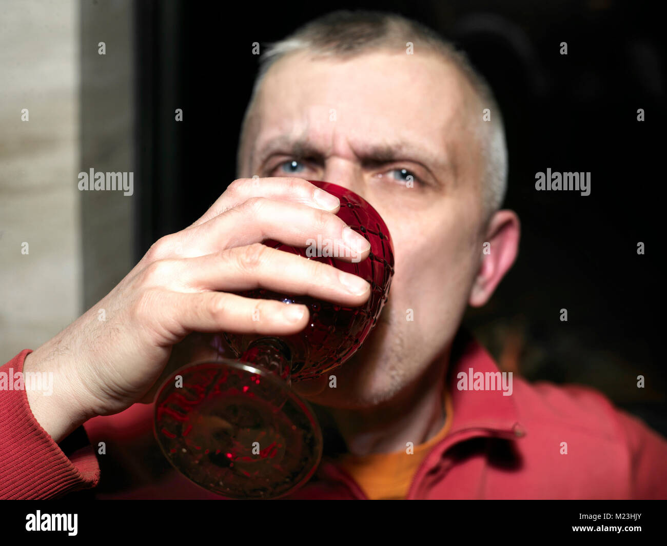Serious man drinking glass hi-res stock photography and images - Alamy