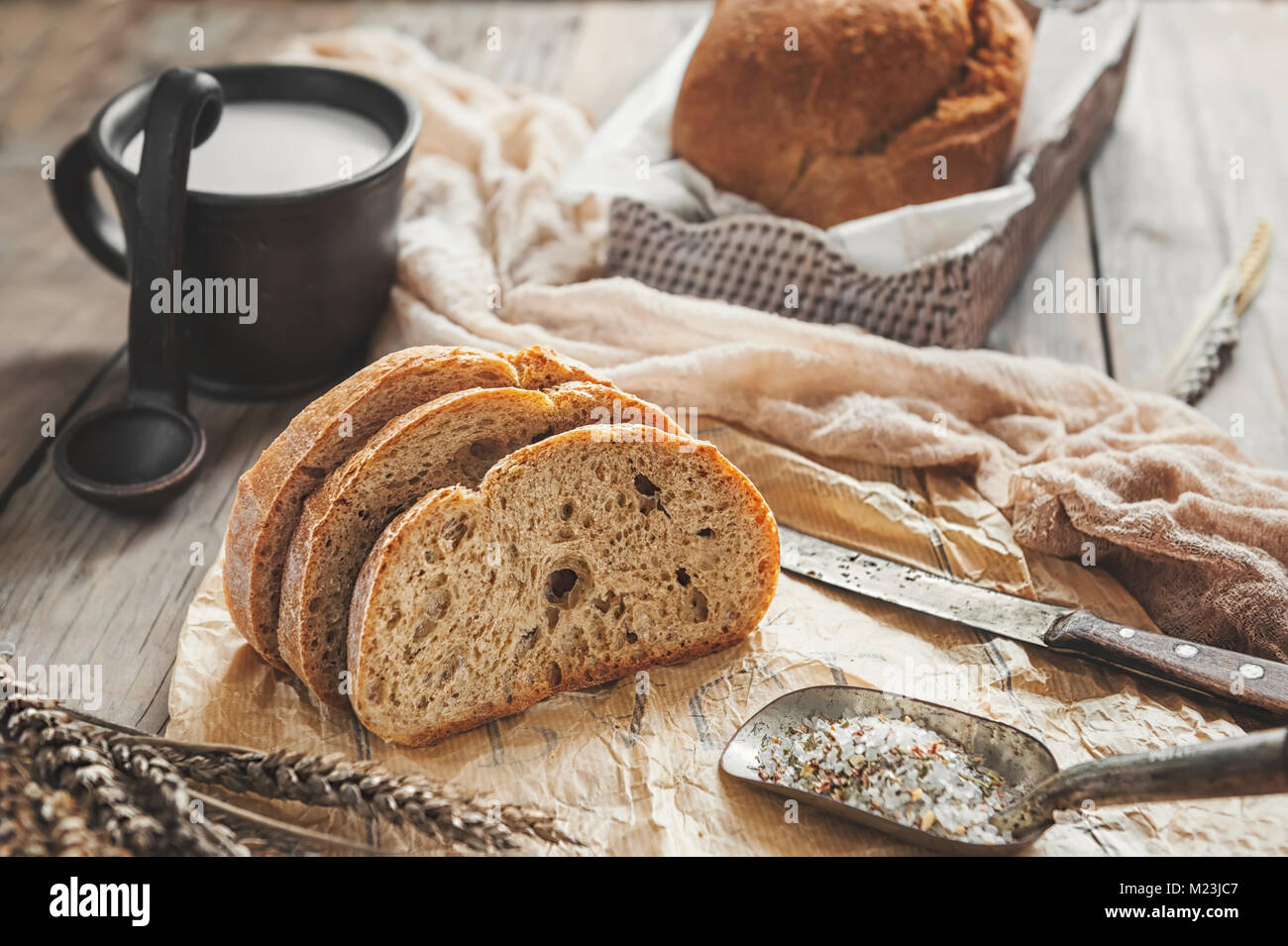 A beautiful loaf of sourdough bread from white wheat on a plate on a ...