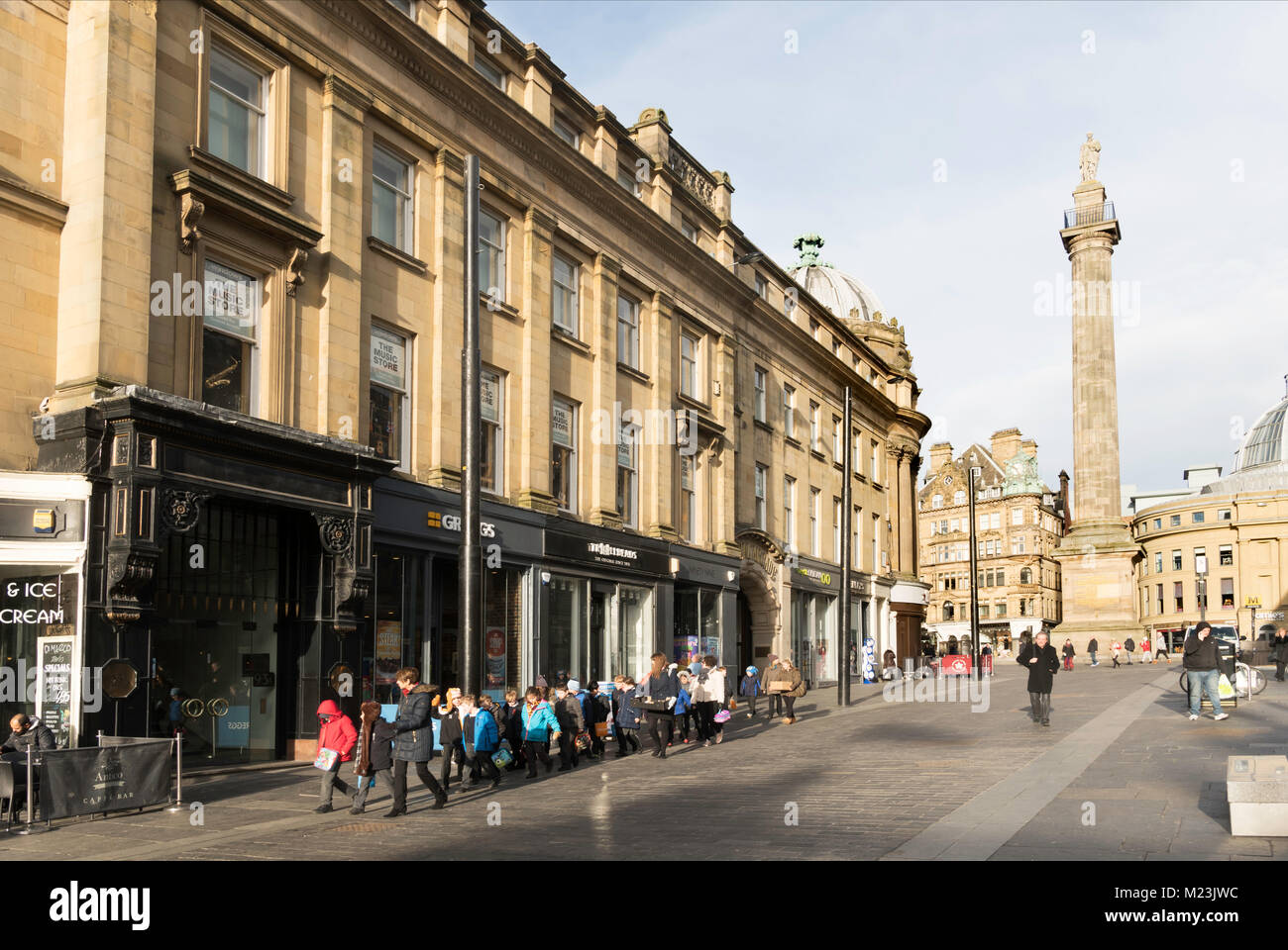 A group of schoolchildren walking down Grey Street, Newcastle, north ...