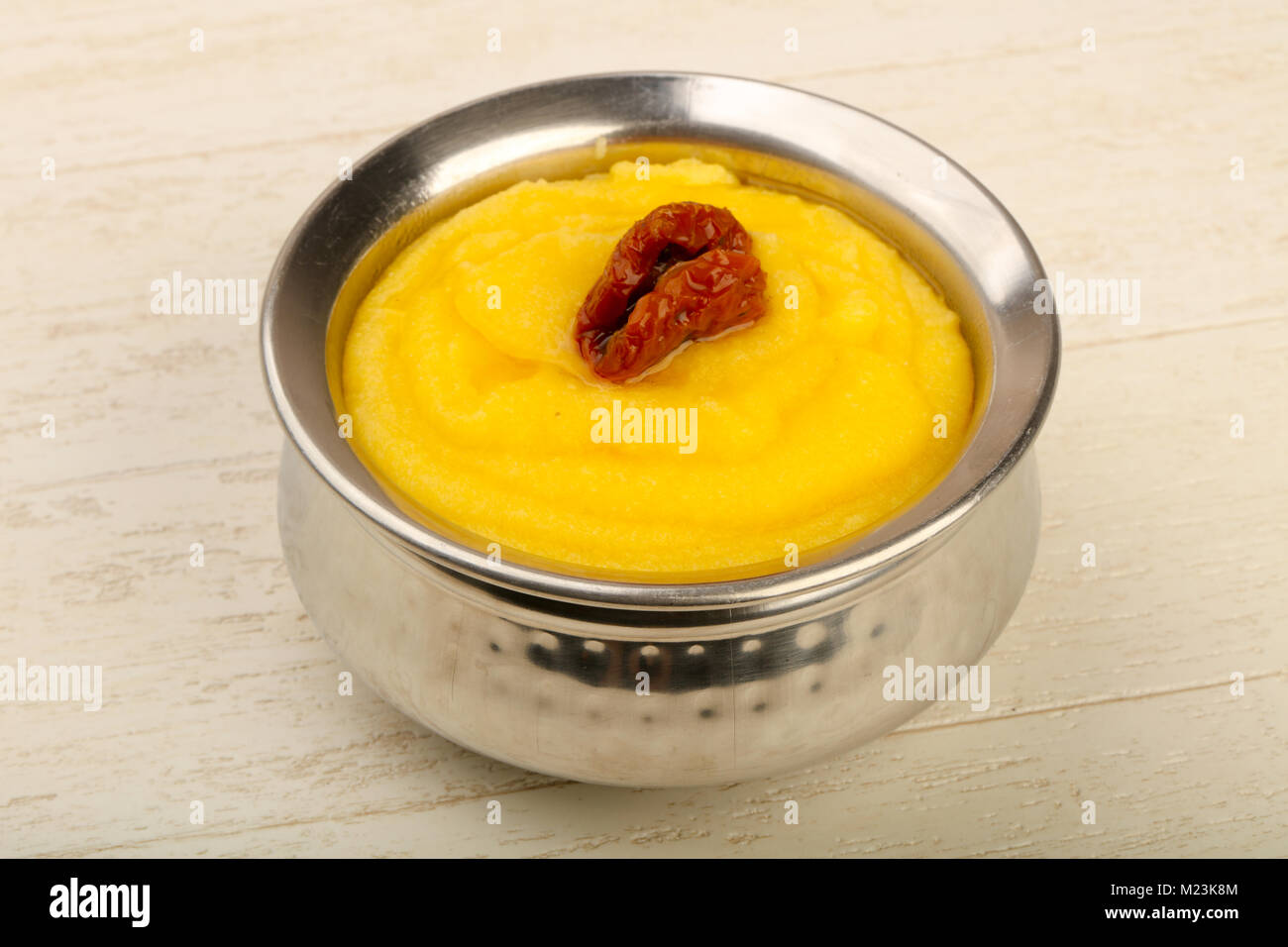 Polenta with dry tomato Stock Photo - Alamy