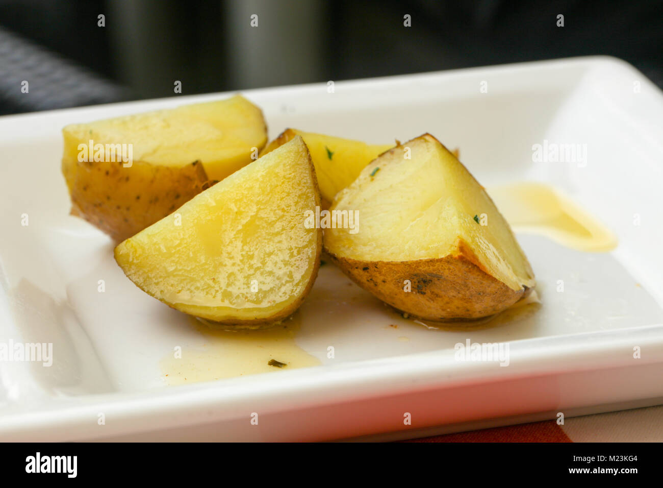 Boiled potato with oil Stock Photo - Alamy