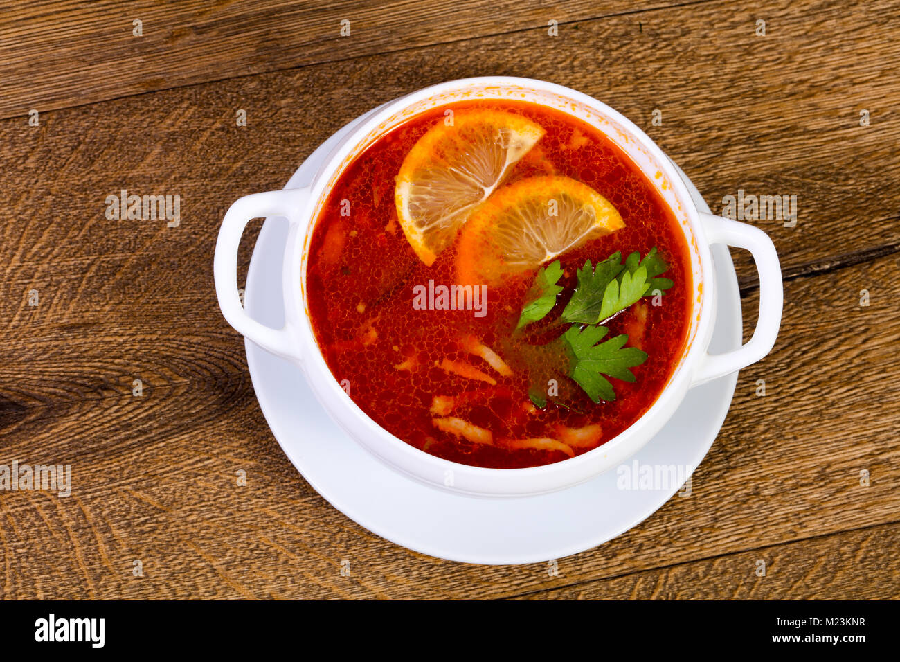 Solyanka soup with lemon serbed parsley Stock Photo - Alamy
