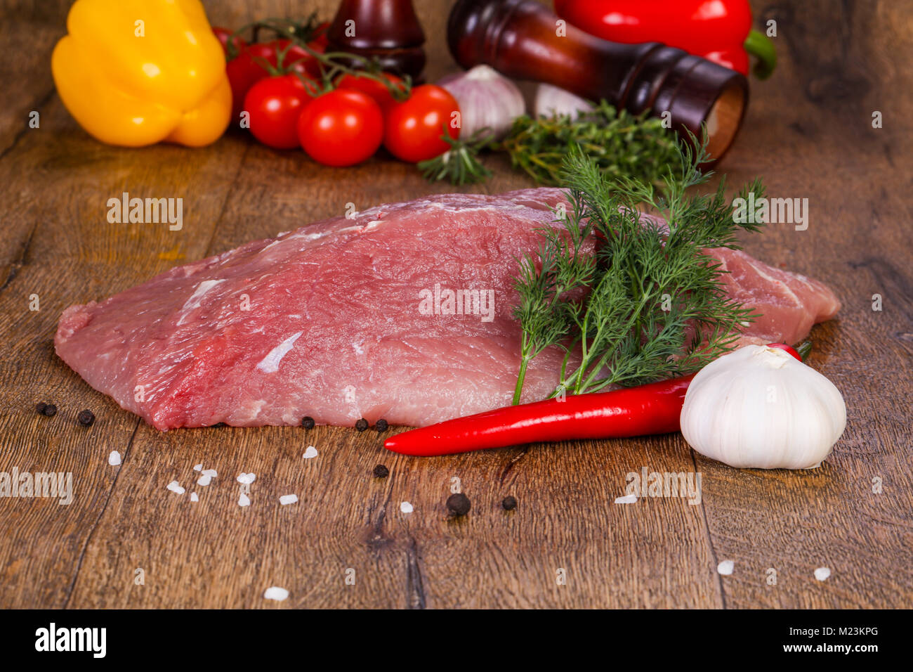 Raw pork meat over wooden background Stock Photo - Alamy