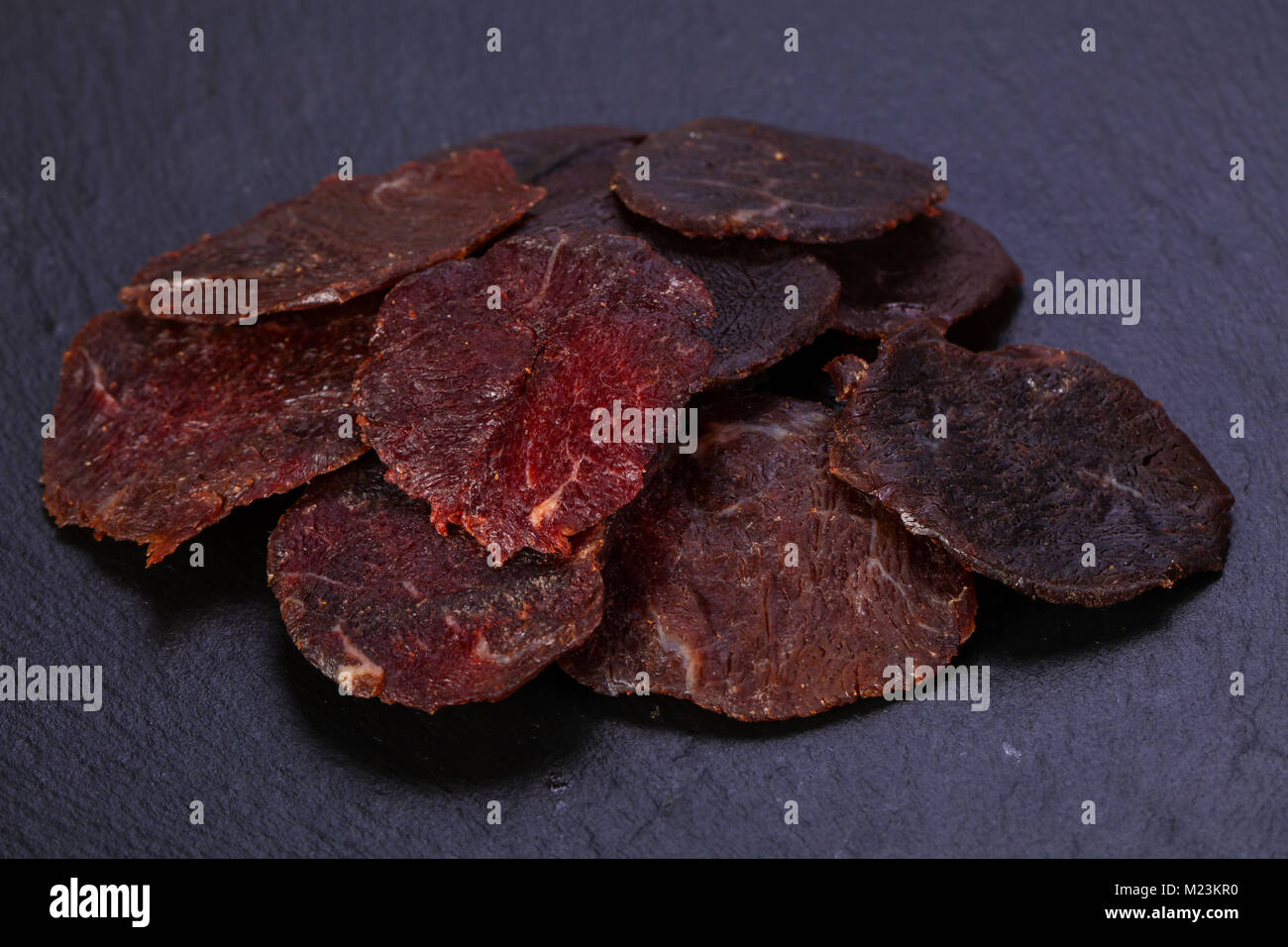 Dry beef meat over wooden Stock Photo - Alamy
