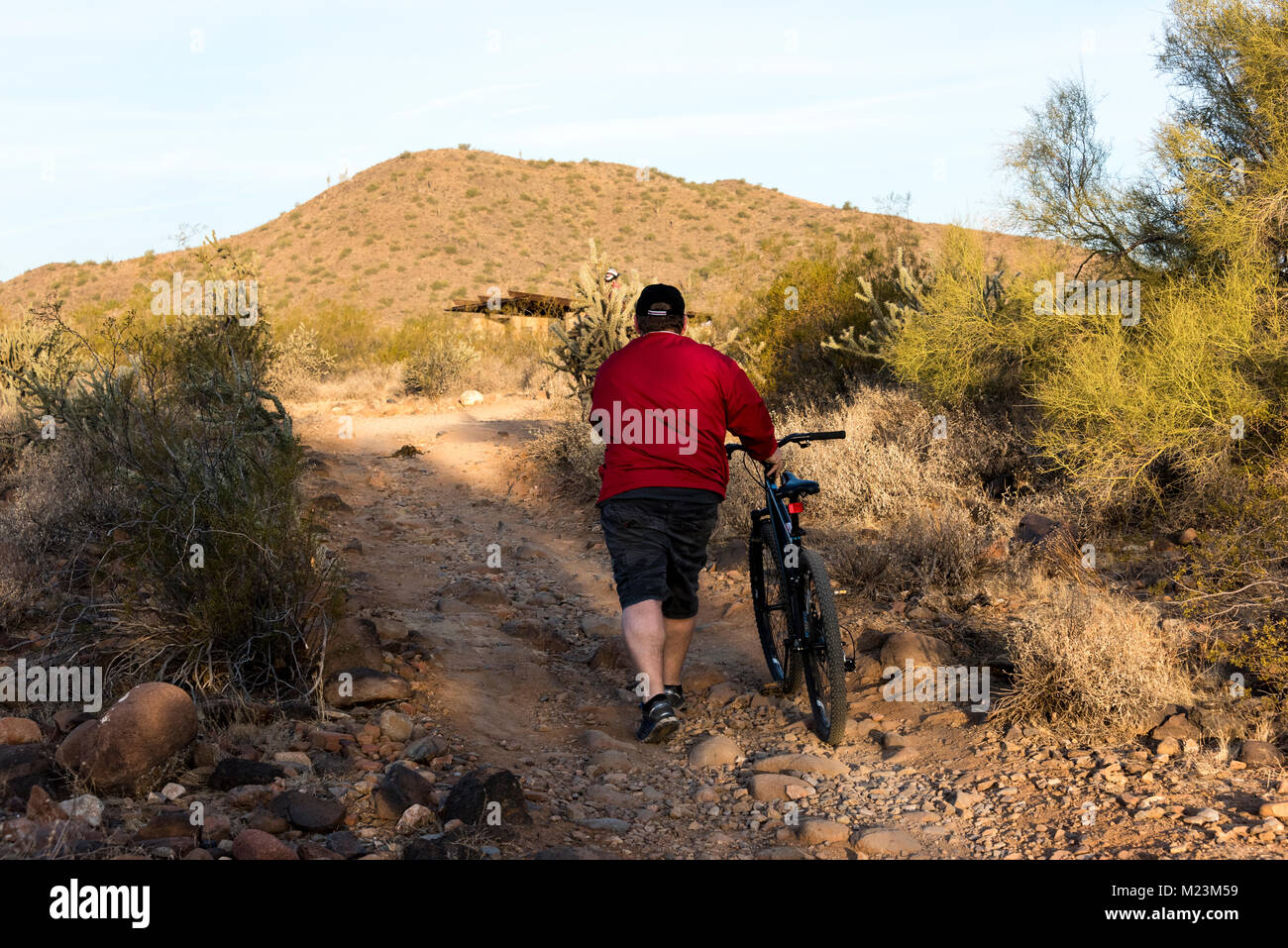 Man taking a sunrise walk in Apache Wash Trailhead in Arizona Stock ...