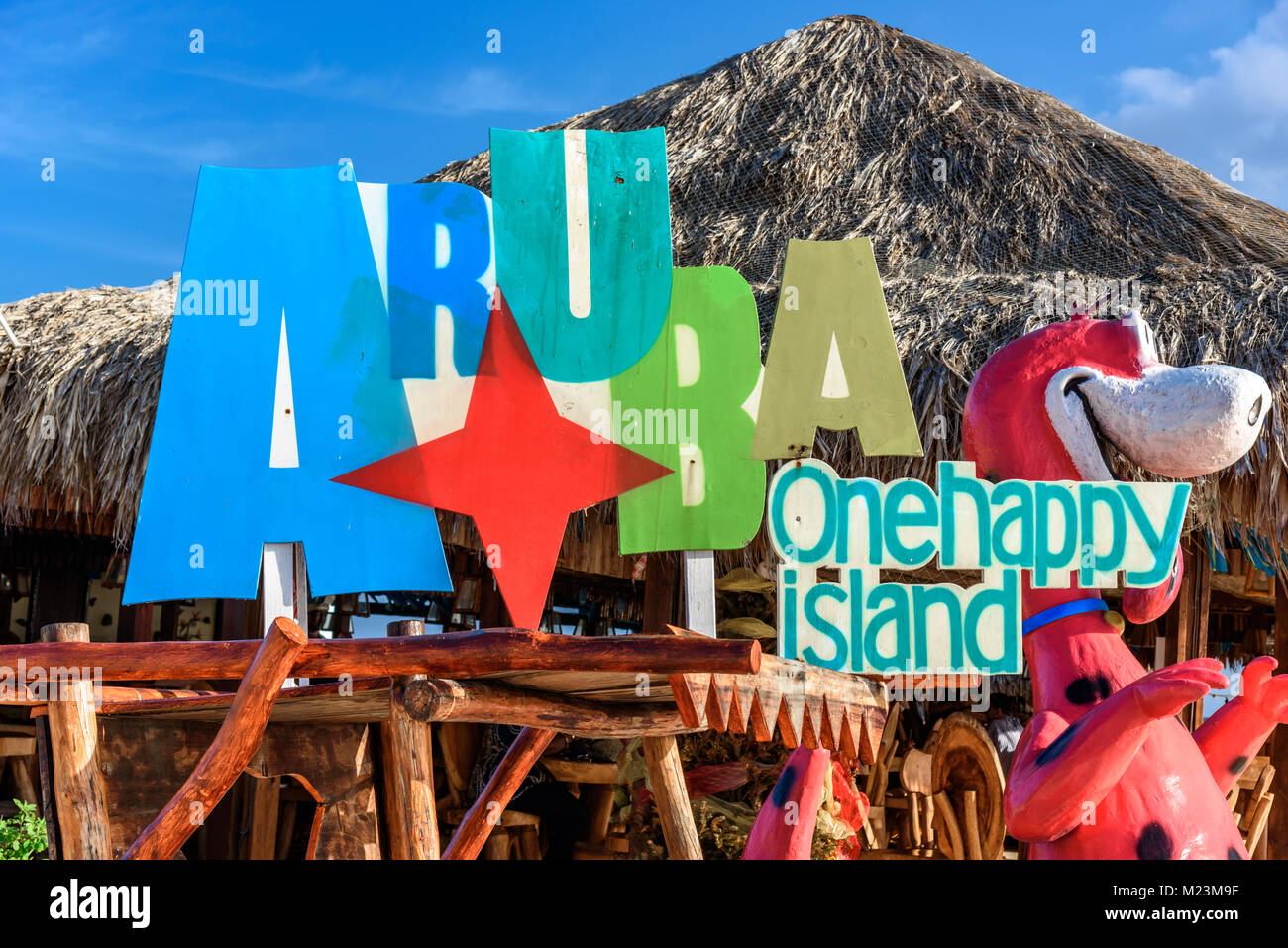 A colorful sign with Aruba slogan at Baby Beach Stock Photo - Alamy