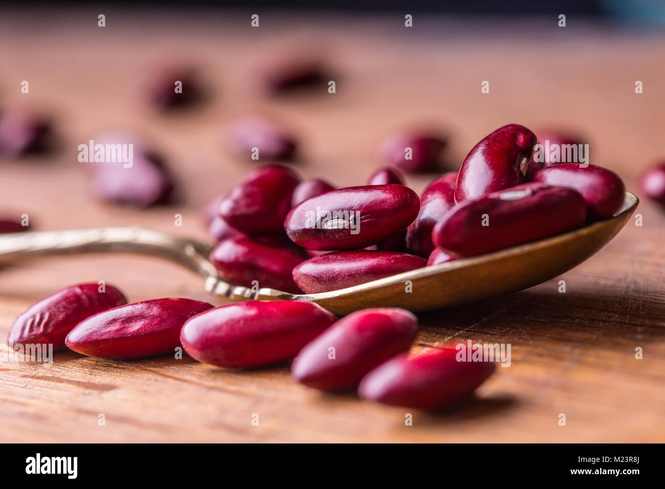 Red beans. Red beans and spoonl on table Stock Photo - Alamy