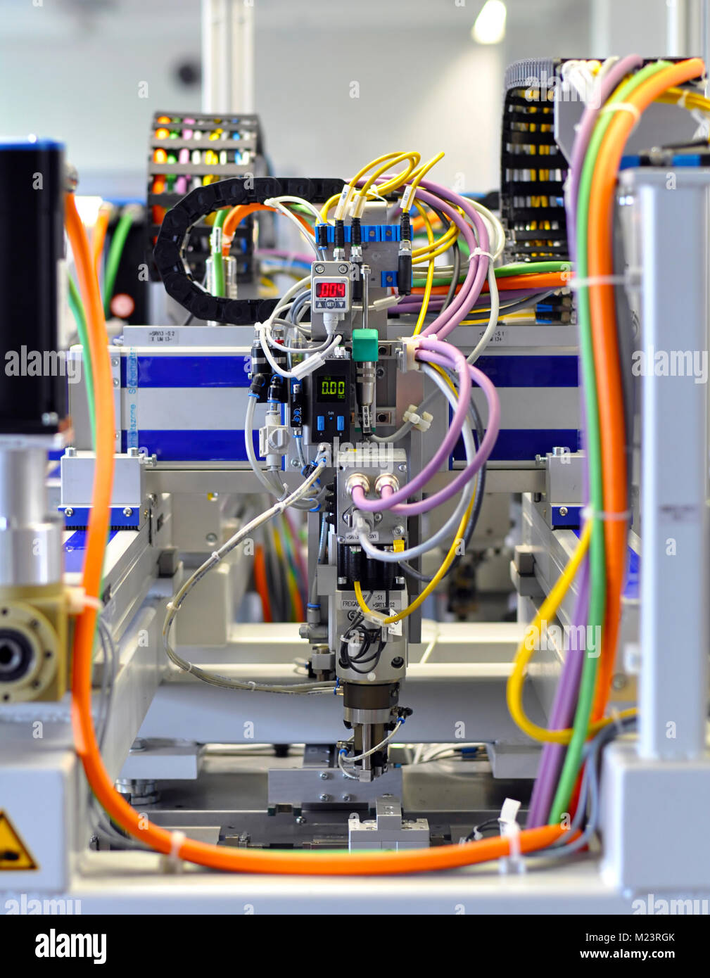 details of a machine with pneumatic lines in industrial production for ...