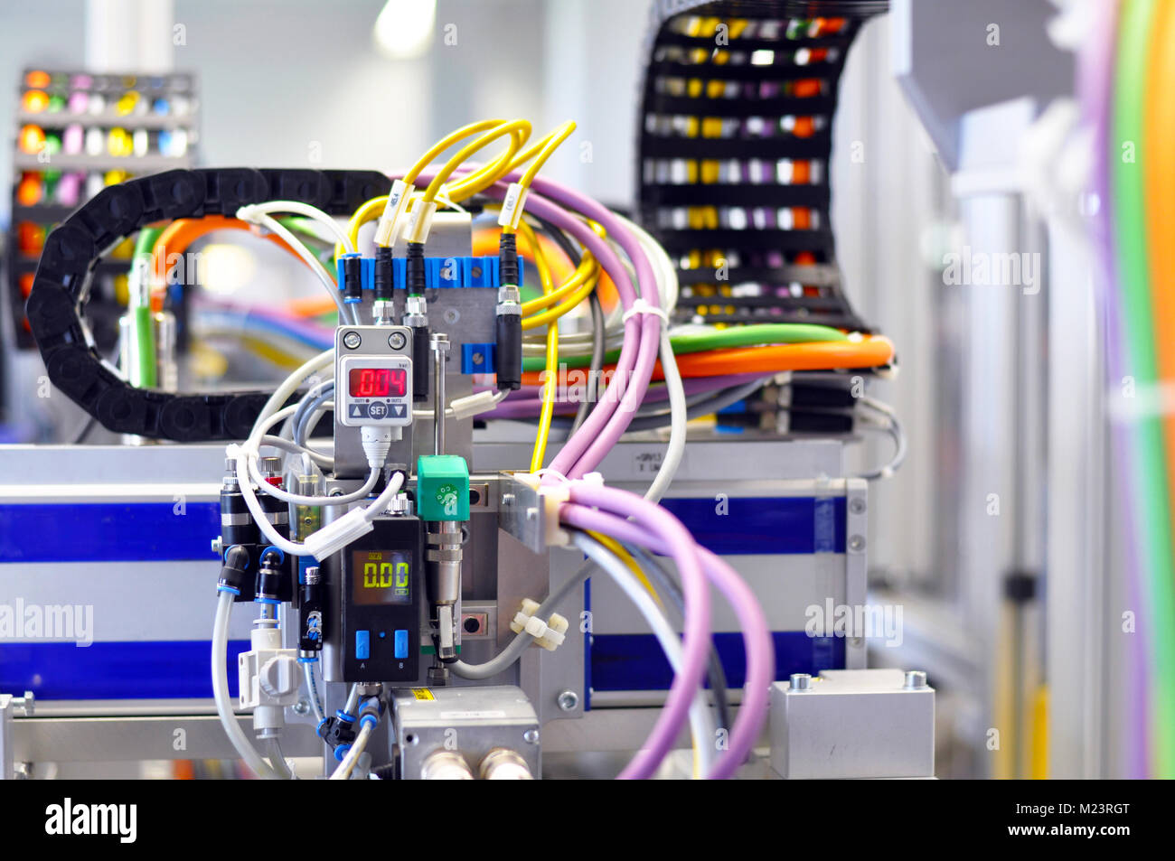 details of a machine with pneumatic lines in industrial production for ...