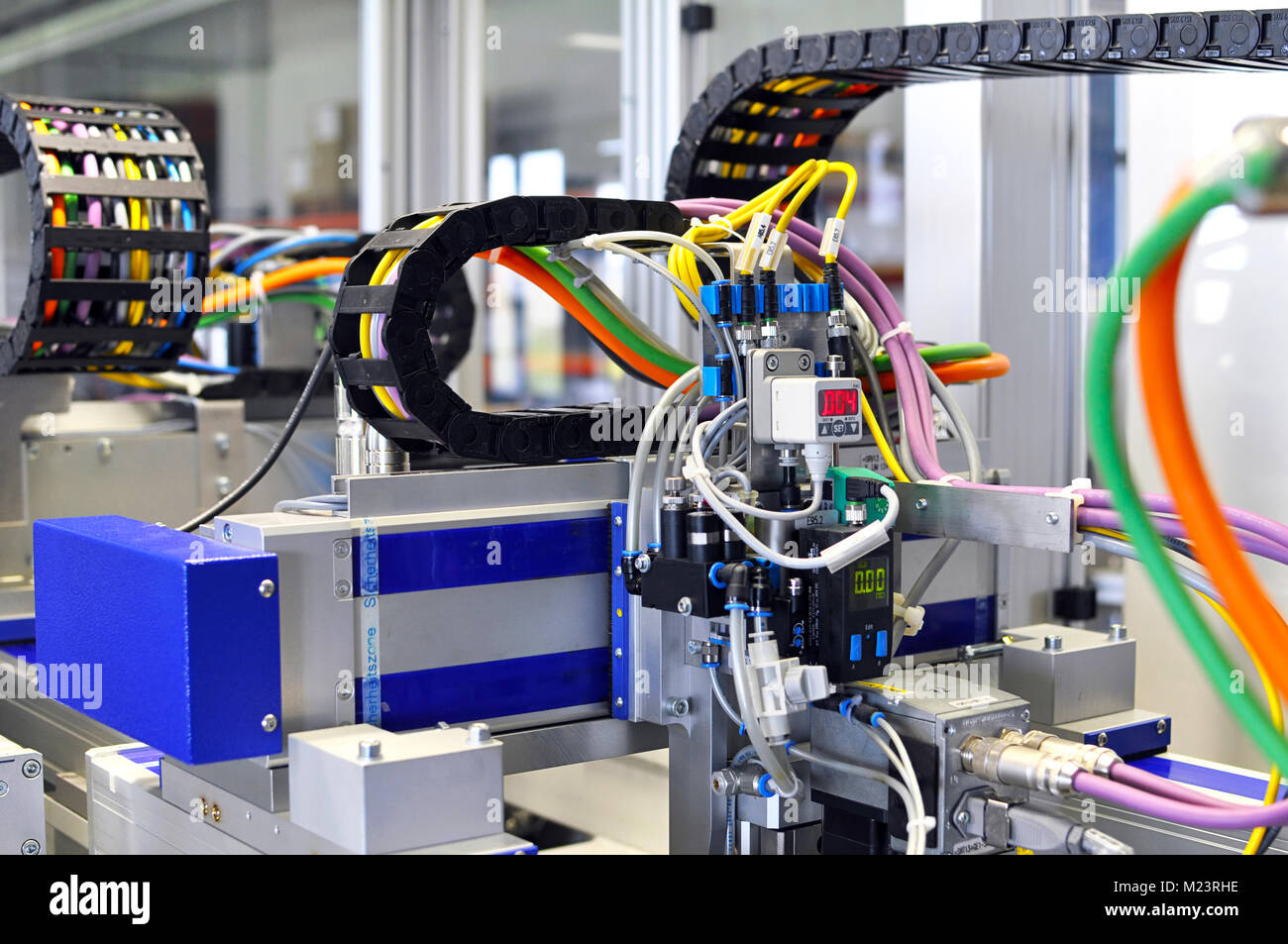 details of a machine with pneumatic lines in industrial production for ...