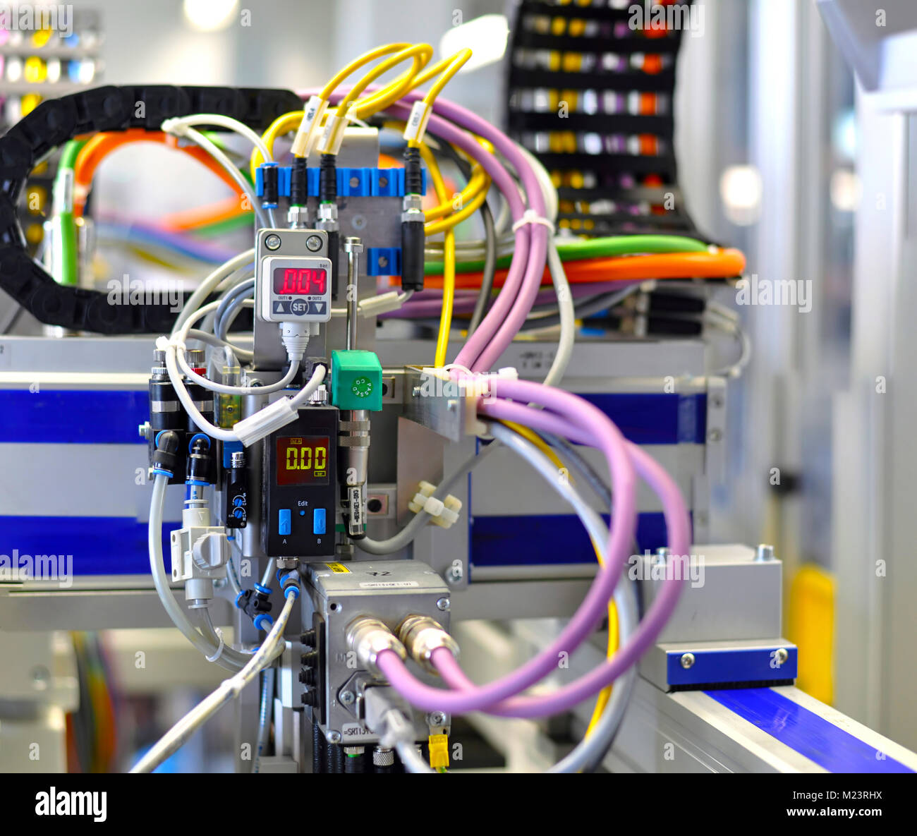 details of a machine with pneumatic lines in industrial production for ...