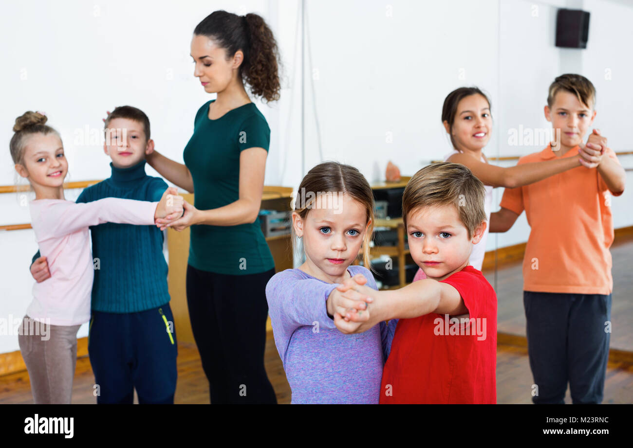 Happy children studying of partner dance at dance school Stock Photo ...