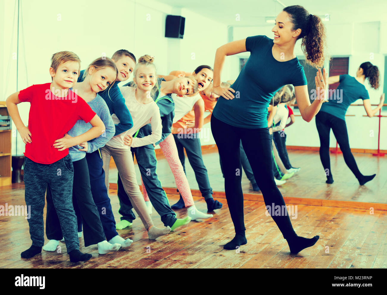Happy cheerful children dancing contemp in studio smiling and having ...