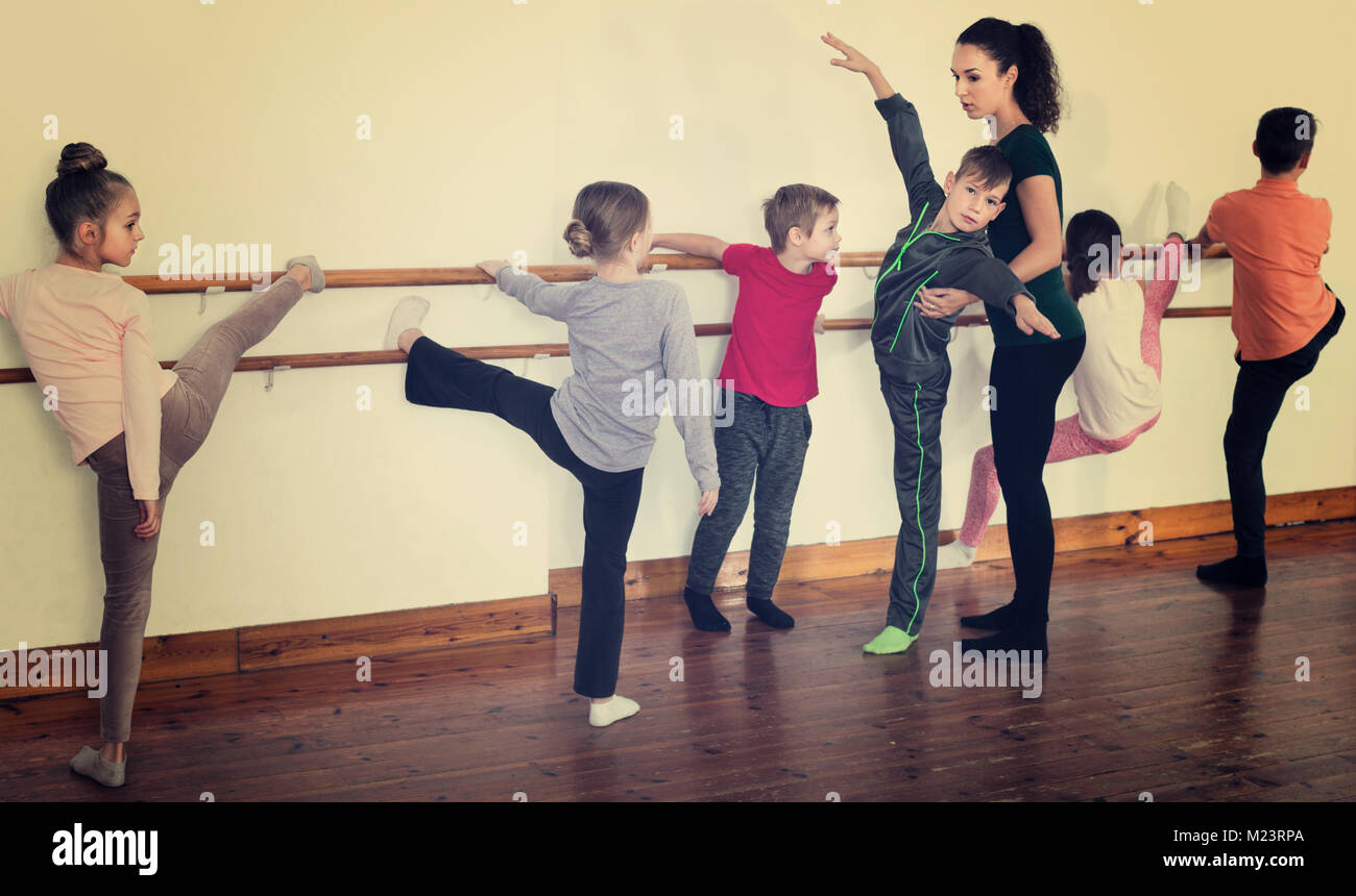 Happy cheerful positive ballet dancers exercising in ballroom Stock ...