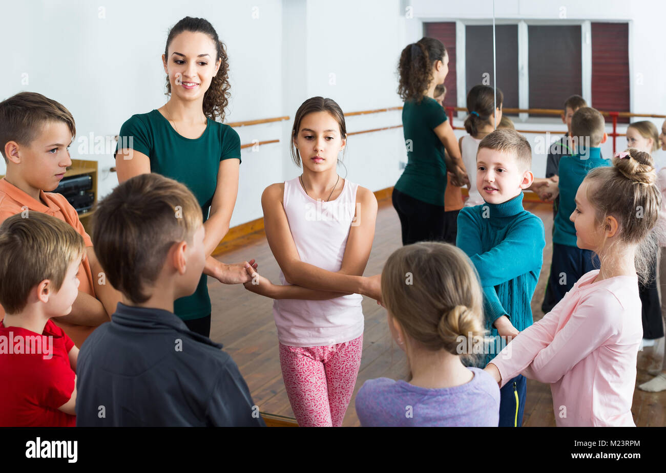 smiling children studying folk style dance in class Stock Photo - Alamy