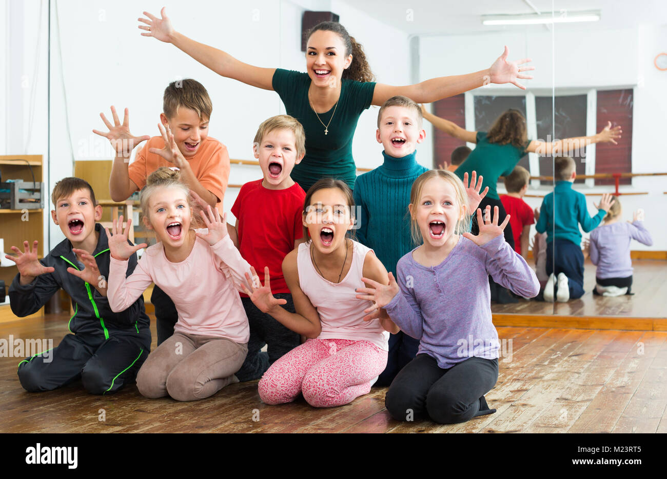 Glad children in dance studio smiling and having fun Stock Photo - Alamy