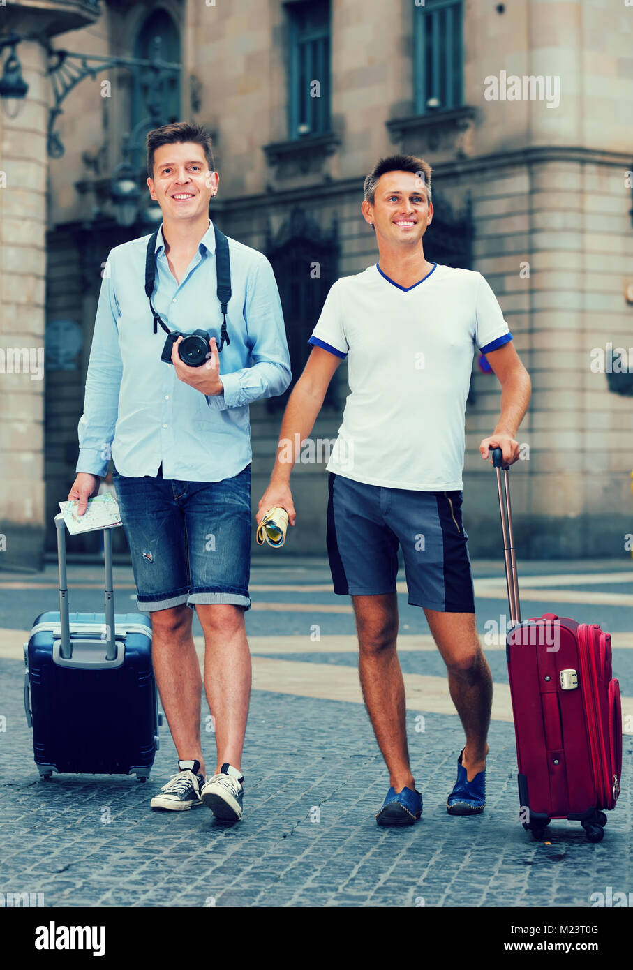 Traveling guys are walking around the European city Stock Photo - Alamy