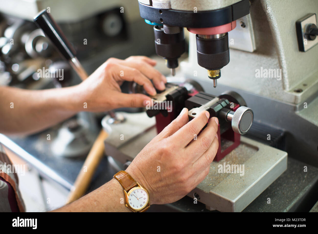 Handyman making door keys hi-res stock photography and images - Alamy