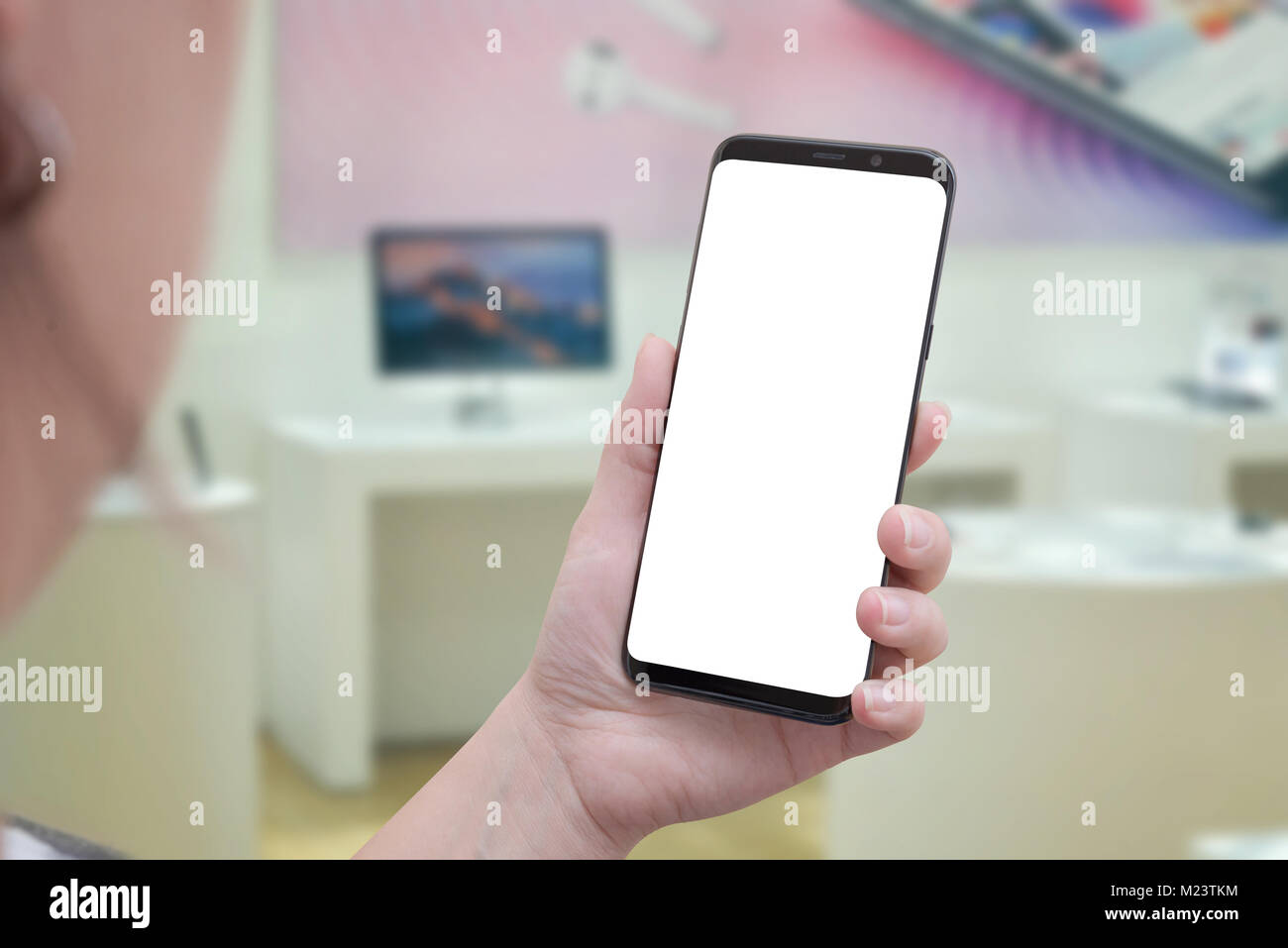 Use mobile phone in office. Isolated screen for mockup. Computers and ...