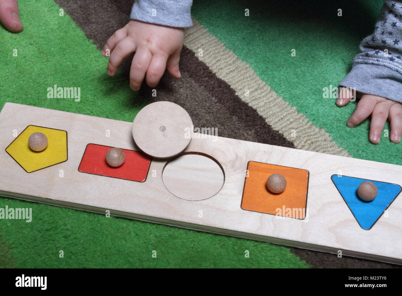 small child educational game with shapes Stock Photo - Alamy