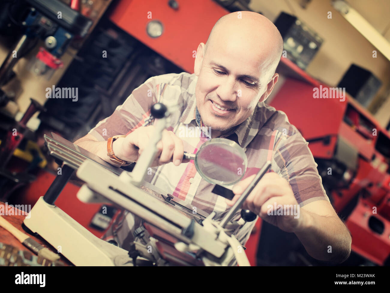 Professional mature workman making hi-res stock photography and images ...