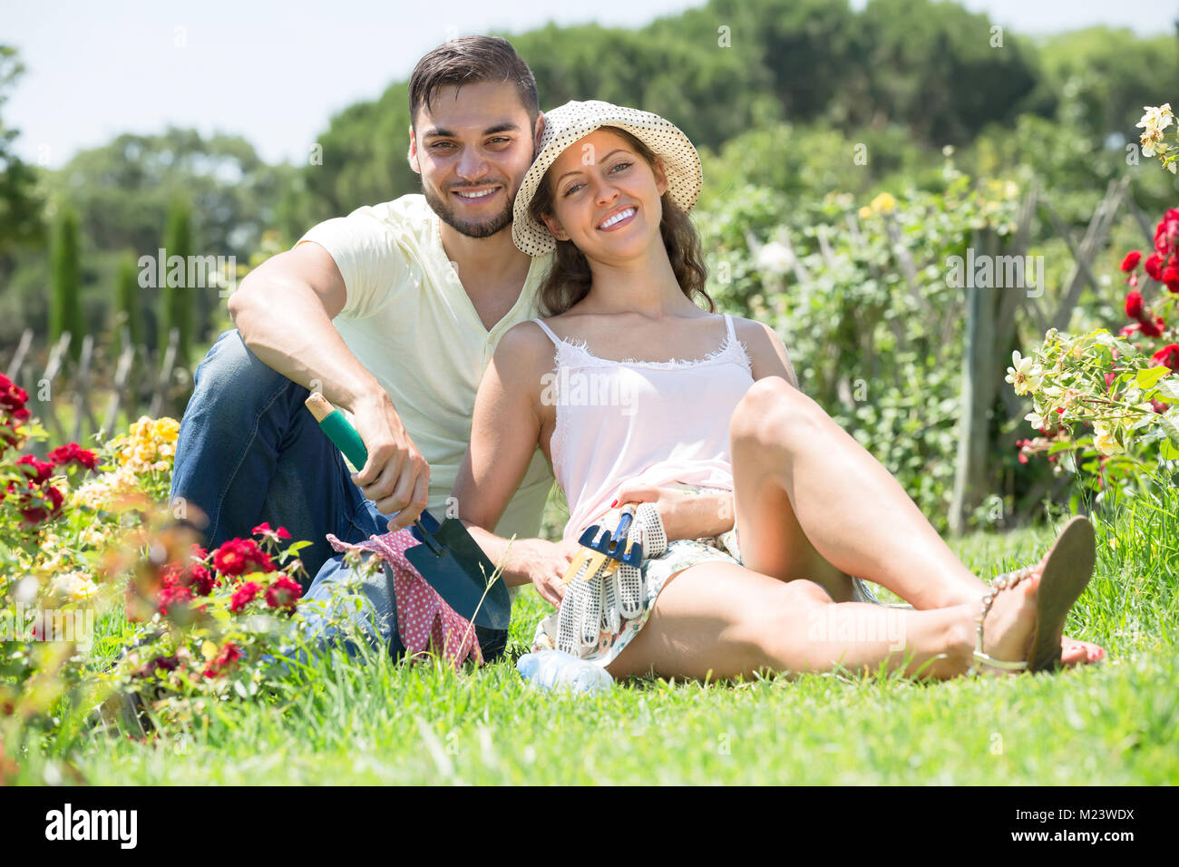 Young couple planting tree together hi-res stock photography and images ...
