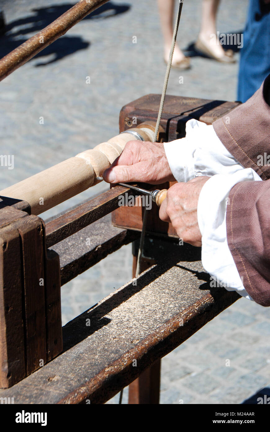 Turner works at one leg of a table Stock Photo - Alamy